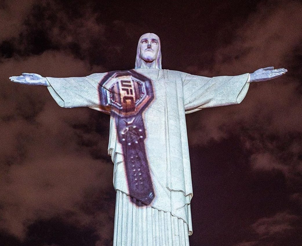 Ultimate projects images of fighters and places a belt on Christ the ...